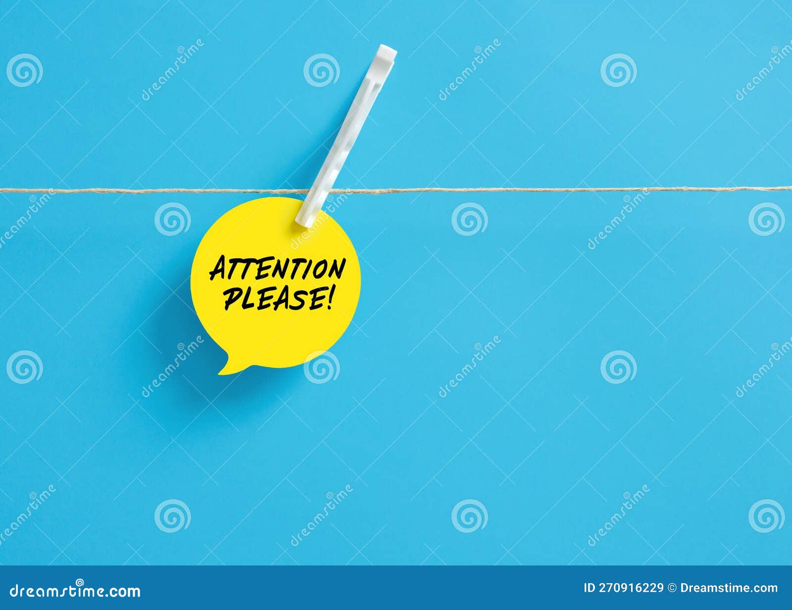 Attention Please Message on a Speech Bubble Hanging on Clothesline with ...