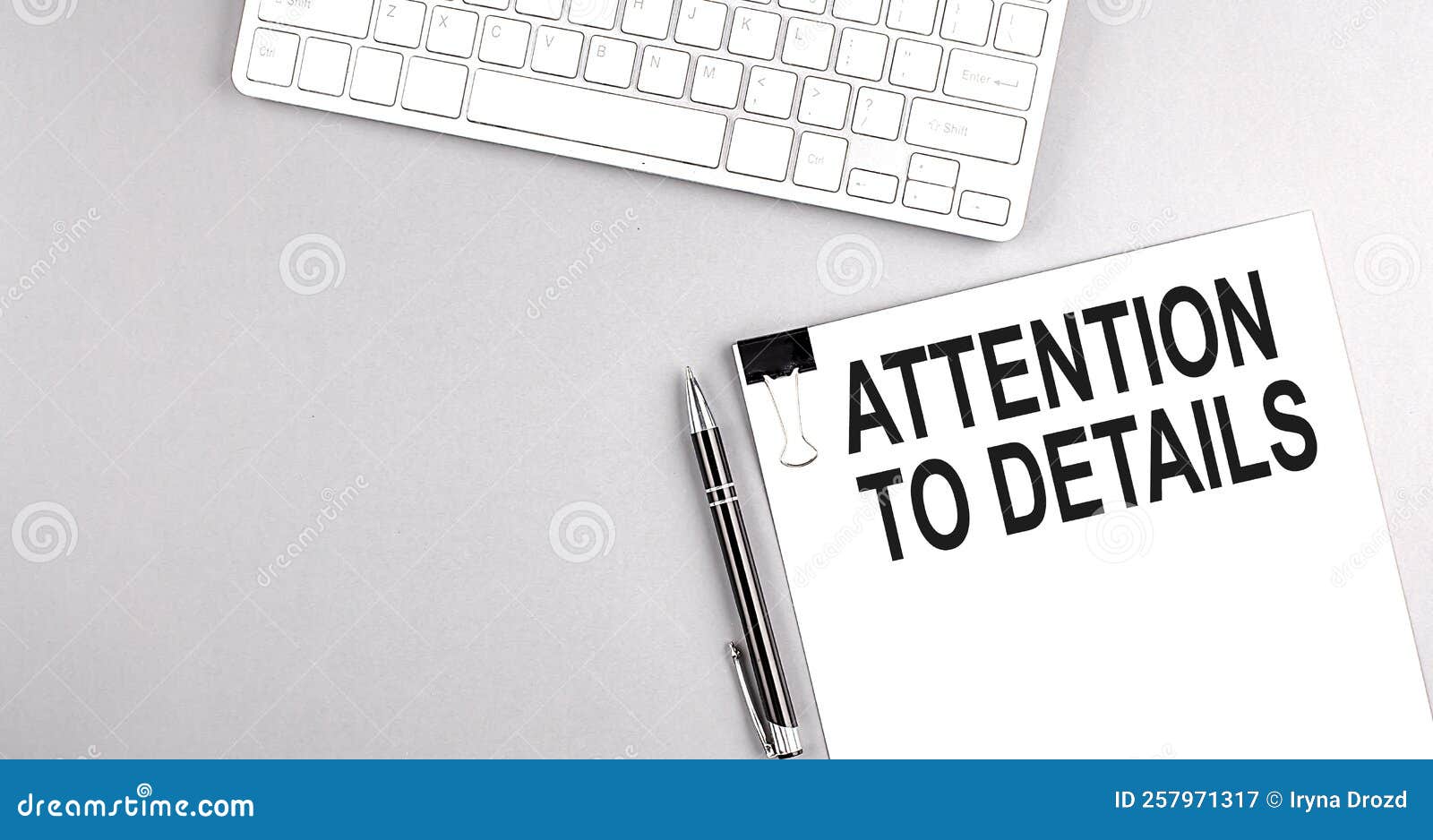 ATTENTION TO DETAILS Text on Paper with Keyboard on Grey Background ...