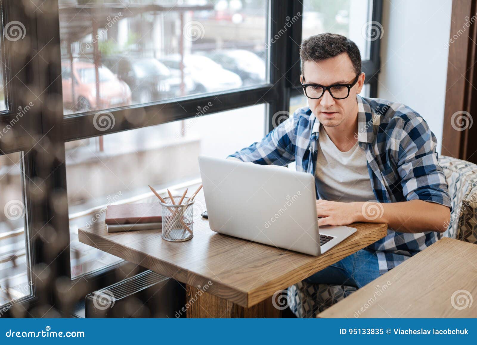 Attentive Attractive Guy Working in a Public Place Stock Image - Image ...