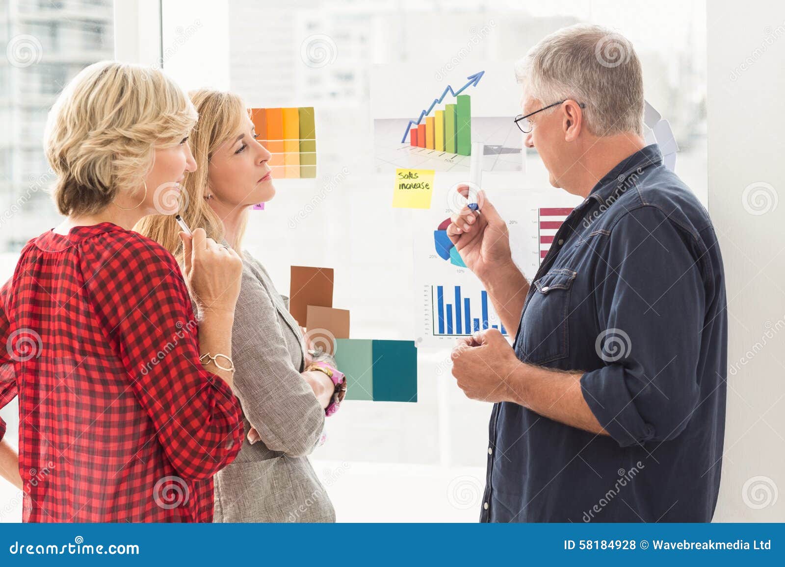 Attentive Business Team Explaining Flow Charts Stock Photo - Image of ...