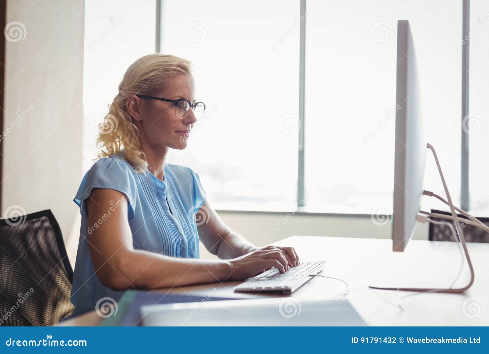 Attentive Executive Working at Personal Computer at Desk Stock Photo ...
