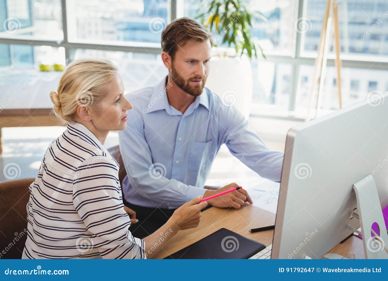 Attentive Executives Working Over Personal Computer at Desk Stock Image ...