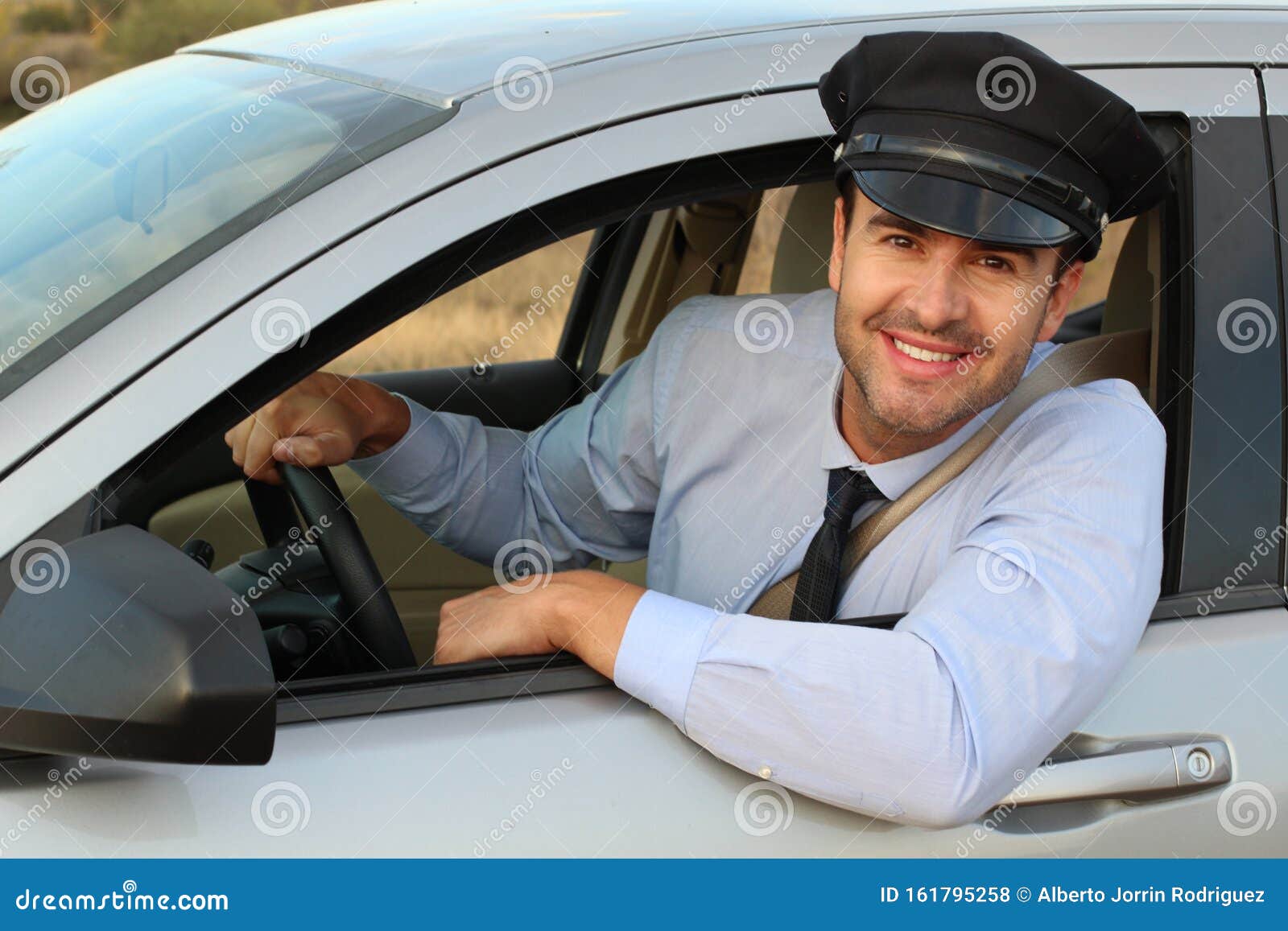 Attentive Looking Professional Driver Smiling Stock Photo - Image of ...