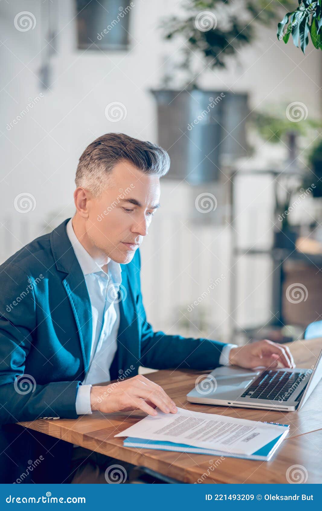 Attentive Man Analyzing Document Working in Office Stock Image - Image ...
