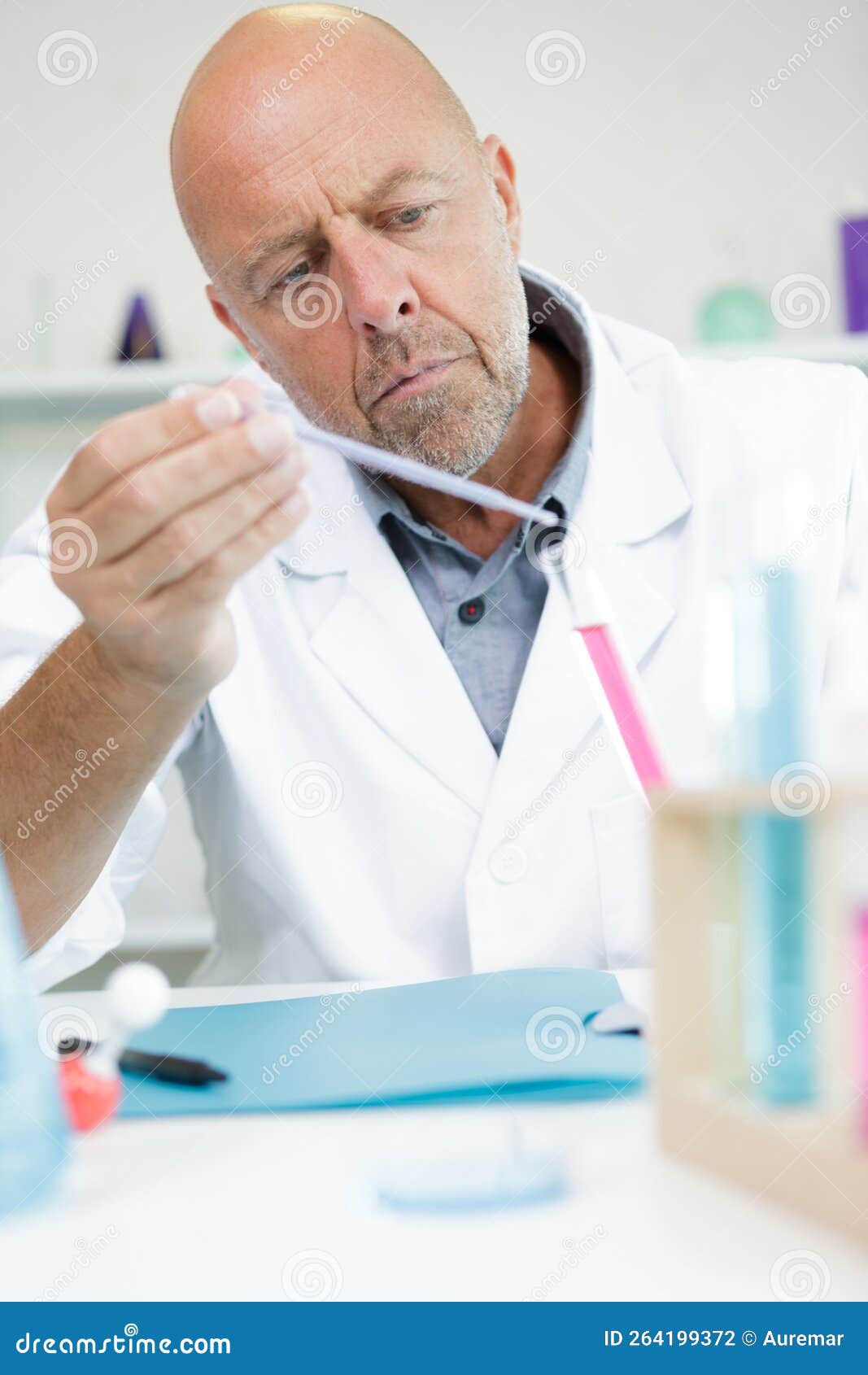 Attentive Mature Scientist Dripping Reagent into Test Tube Stock Photo ...