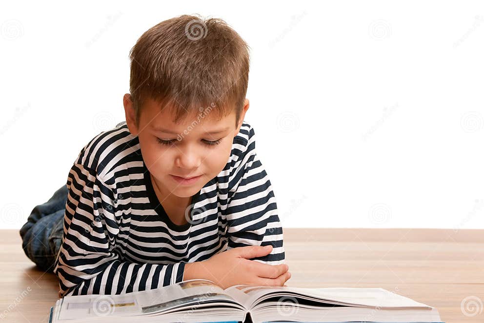 Attentive reading boy stock photo. Image of american - 16690246