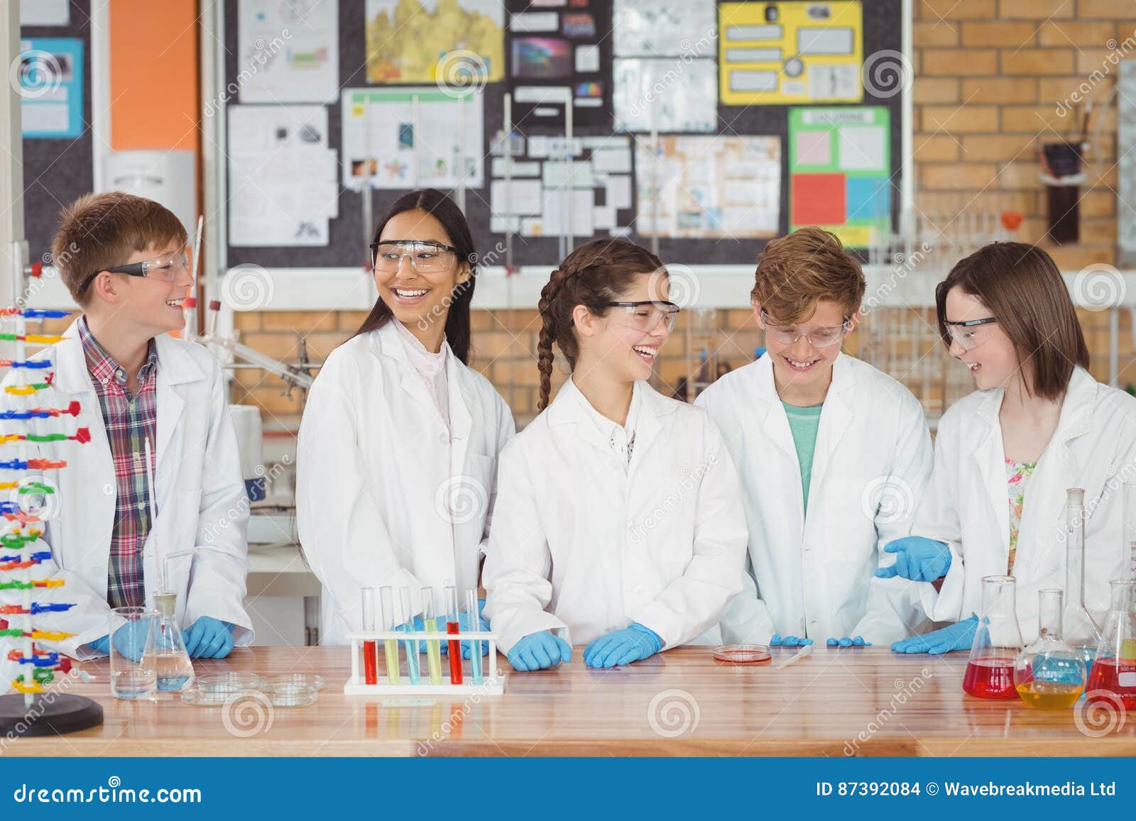 Attentive School Kids Doing a Chemical Experiment in Laboratory Stock ...