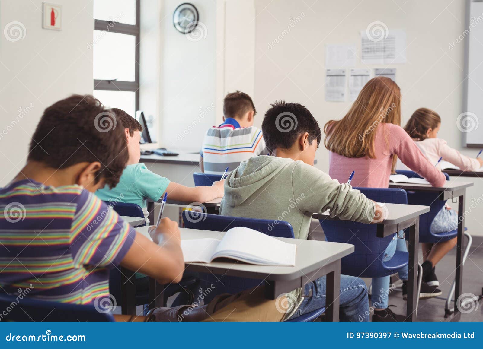 Attentive School Kids Doing Homework in Classroom Stock Image - Image ...