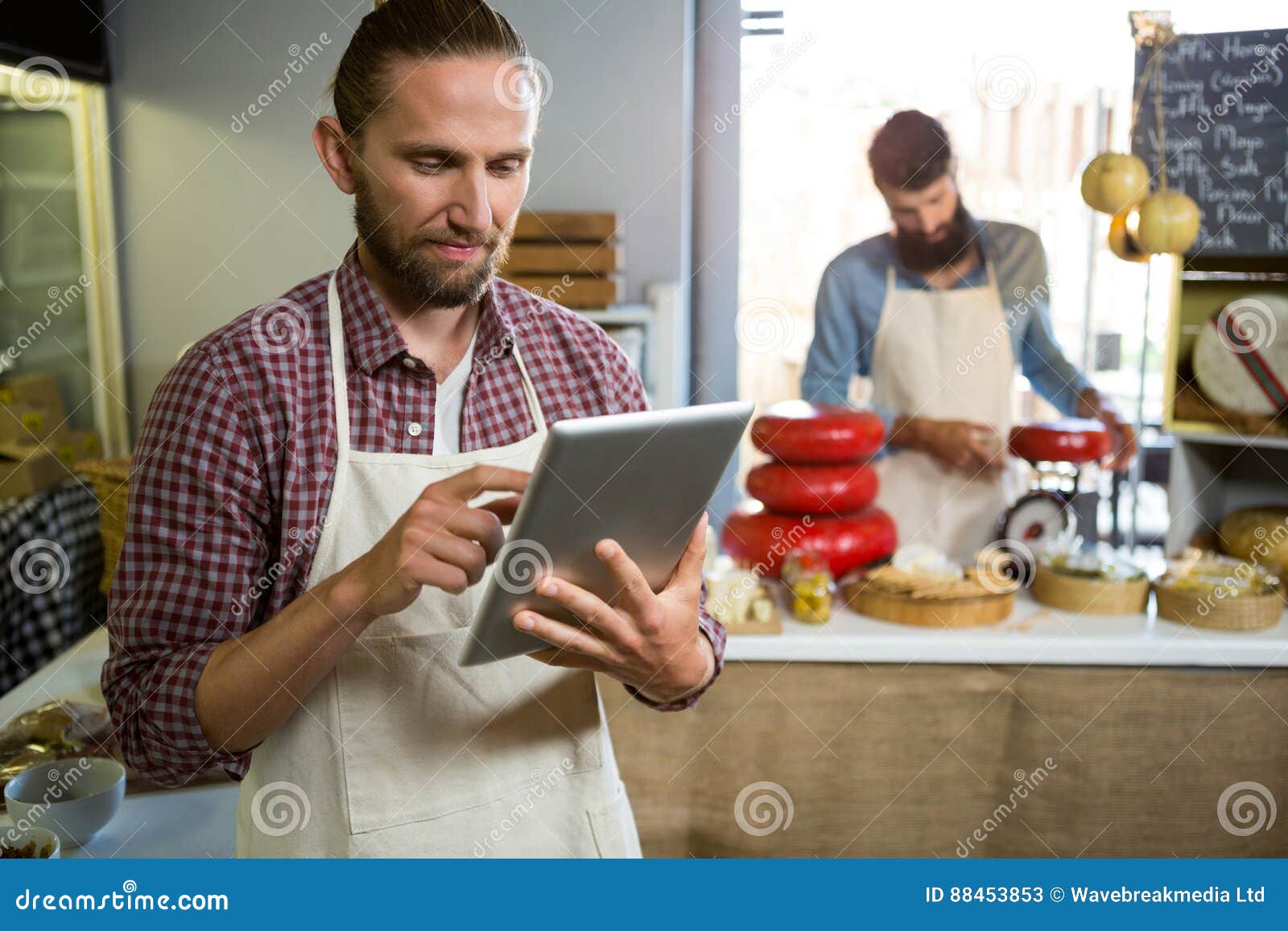 Attentive Staff Using Digital Tablet at Counter Stock Image - Image of ...
