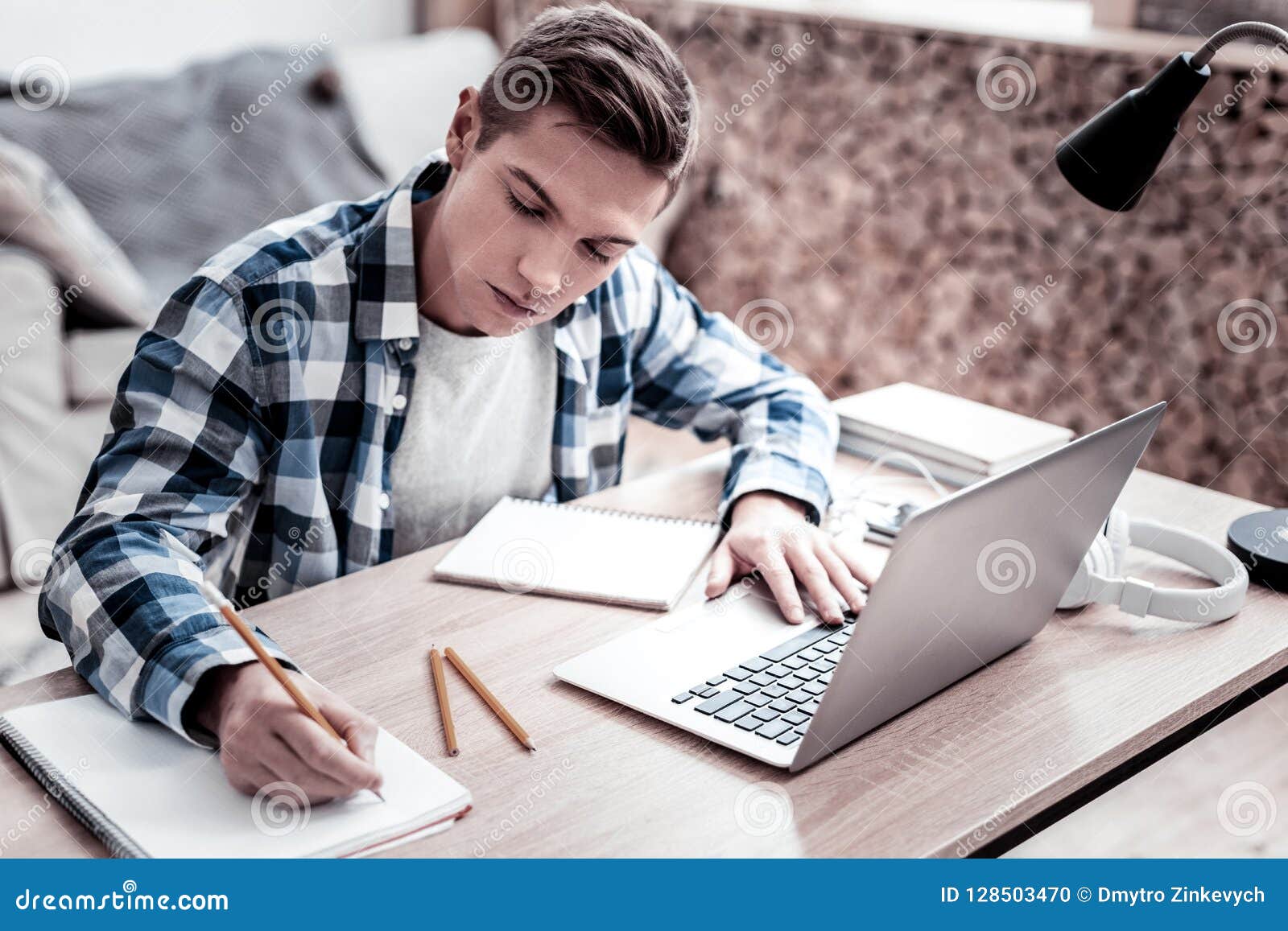 Attentive Student Making Notes while Doing Homework Stock Photo - Image ...