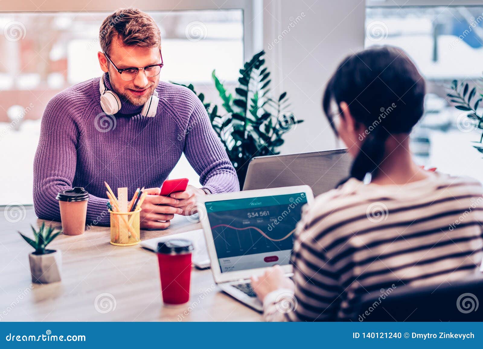 Attentive Young Man Reading Message from Friend Stock Photo - Image of ...