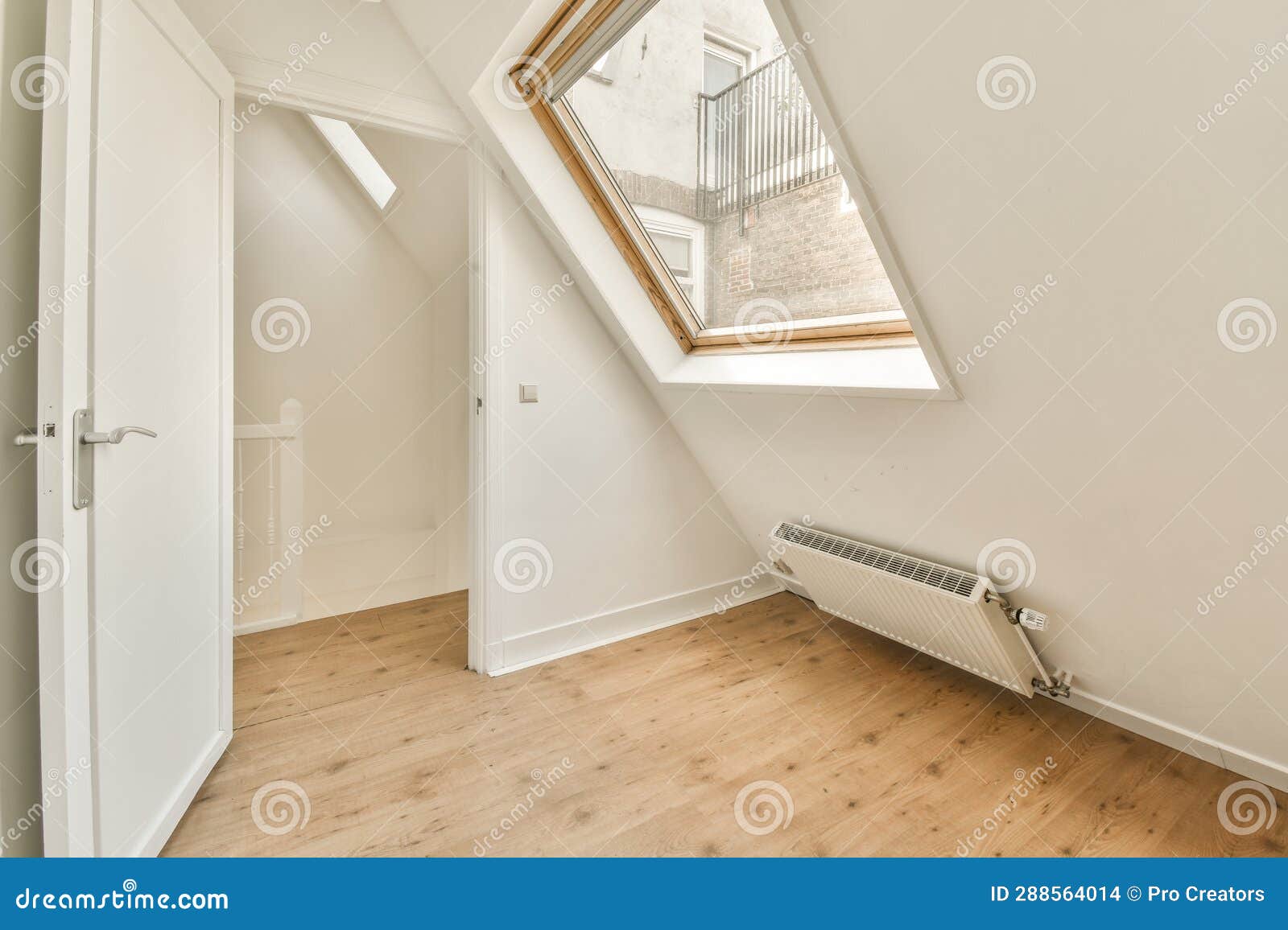 A Loft Conversion with a Window and a Wooden Floor Stock Photo - Image ...