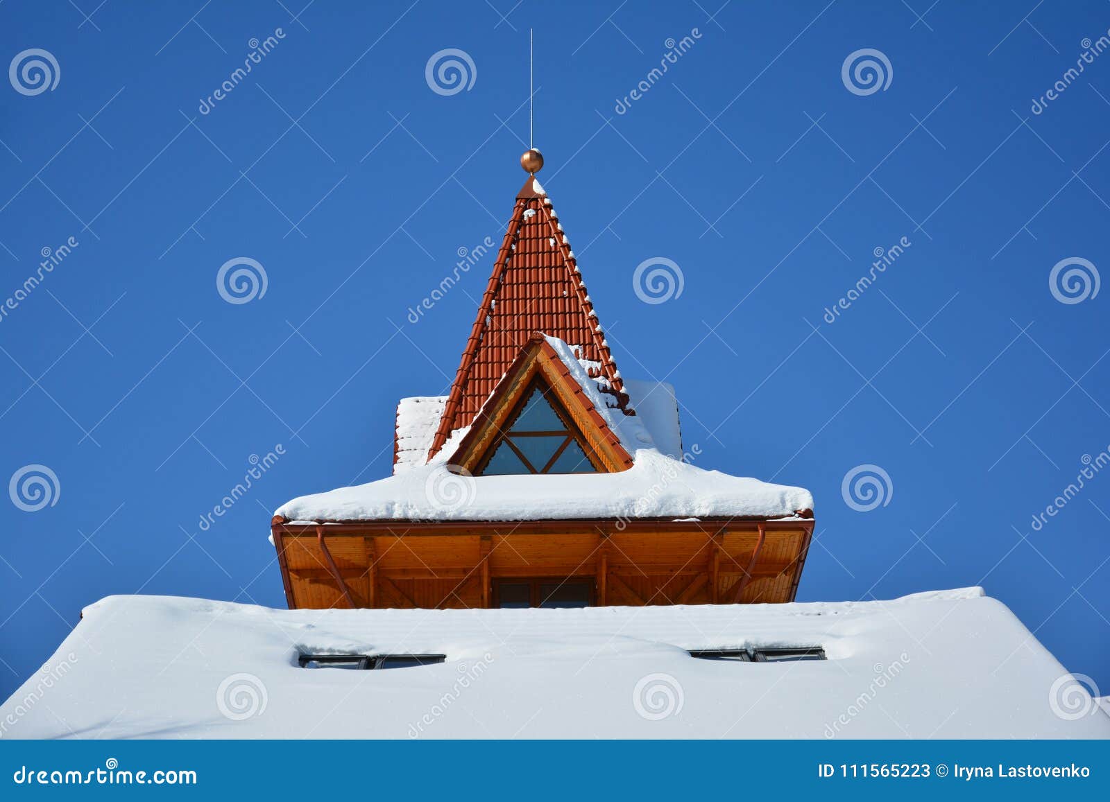 Attic Window of Triangular Shape on Snow-covered Roof on Background of ...