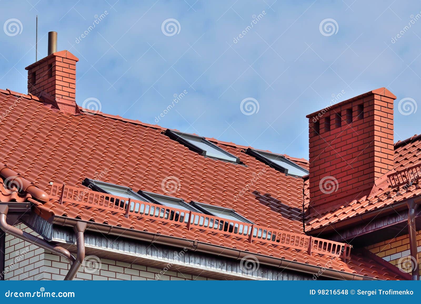 Attic windows on tile roof stock photo. Image of brick - 98216548