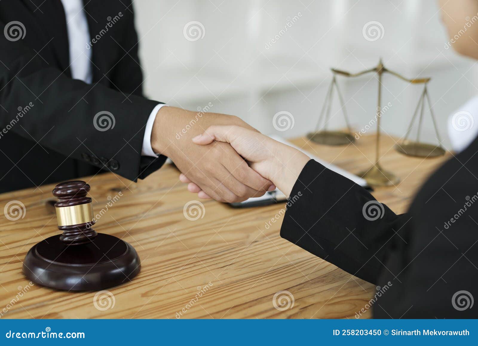 Attorney Shaking Hands with Client for Agreement Regarding Case in ...
