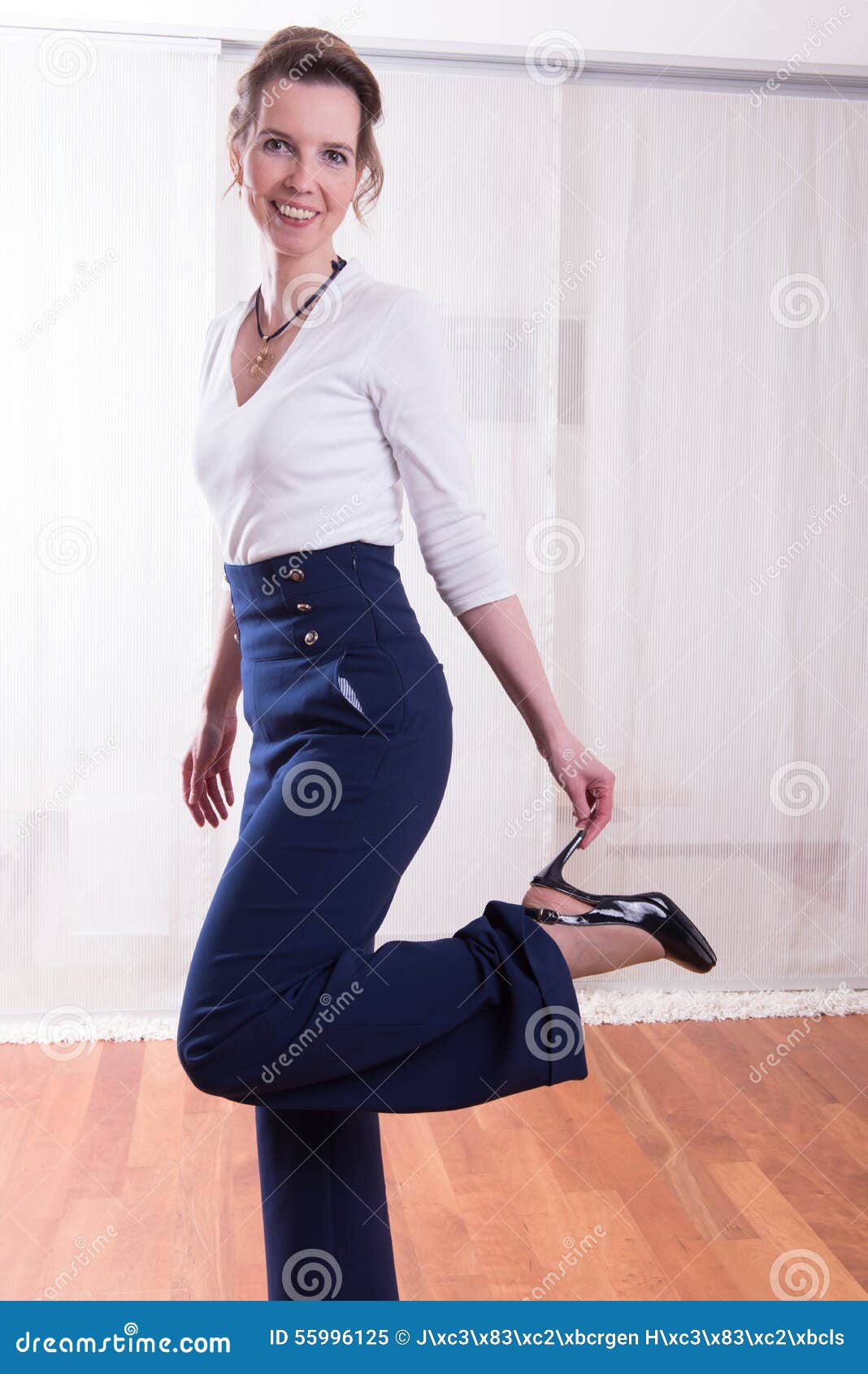 Attracative Woman Holding Her Leg Up Stock Image - Image of ager ...