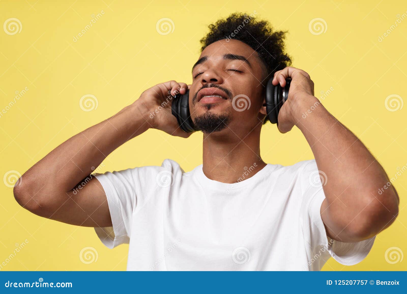 Attractive African American Man With Headphones Listen To Music