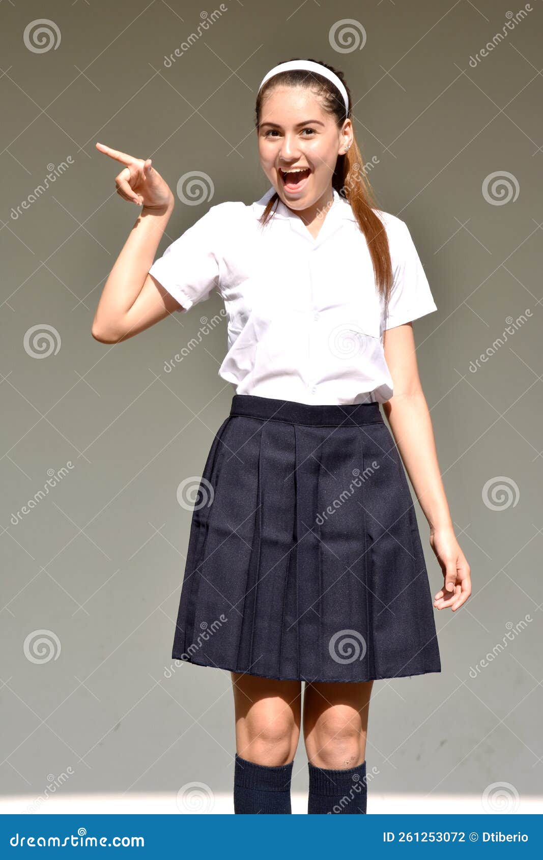 A Pointing Cute Female stock photo. Image of direction - 261253072