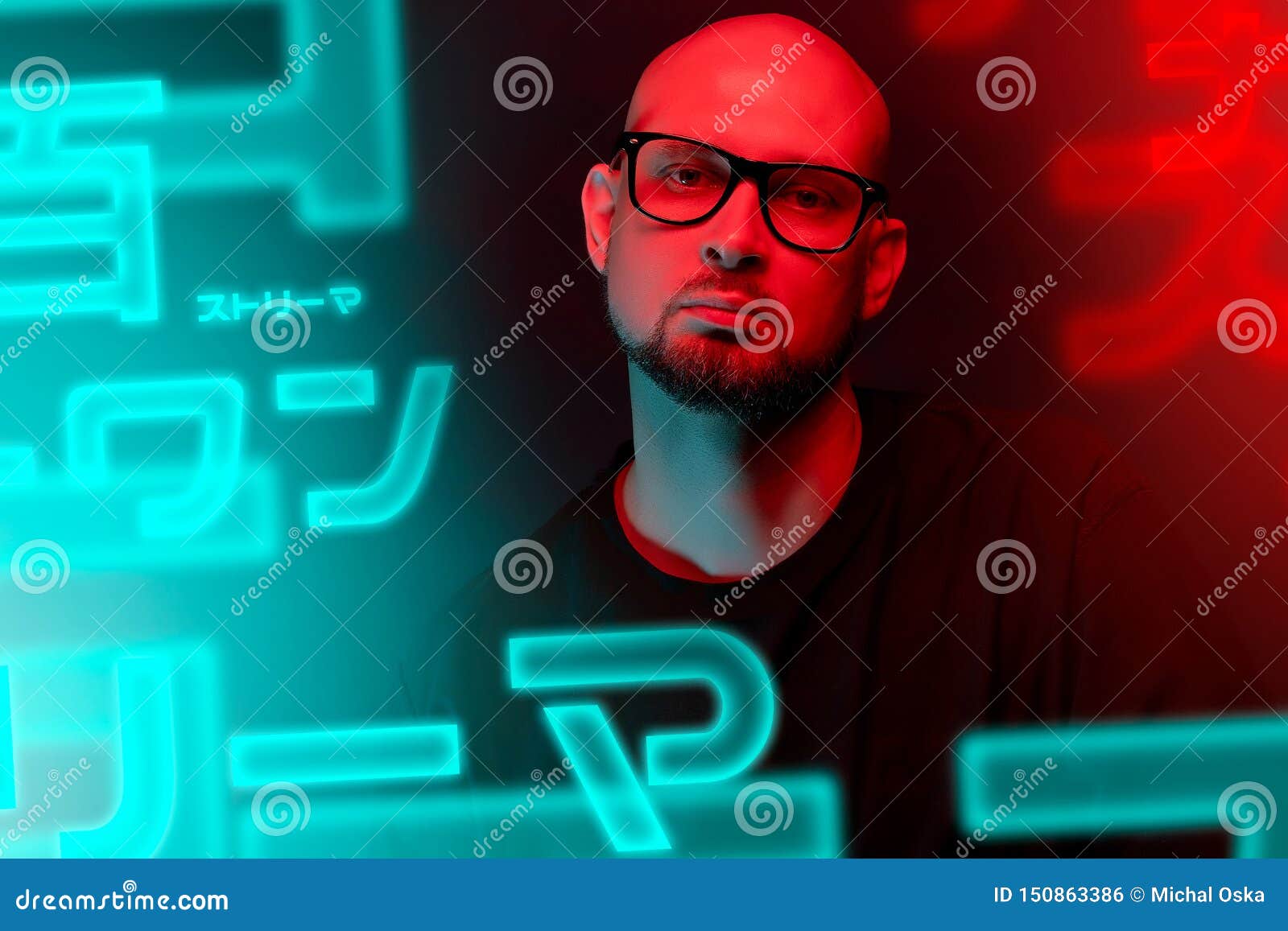 Attractive Bald Man with Beard in Glasses on Neon Light Background ...