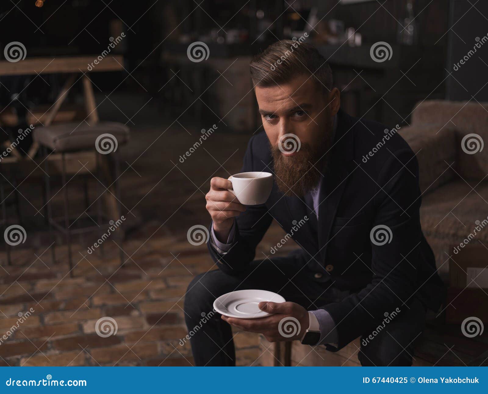 Attractive Bearded Businessman Is Enjoying Hot Coffee Stock Image