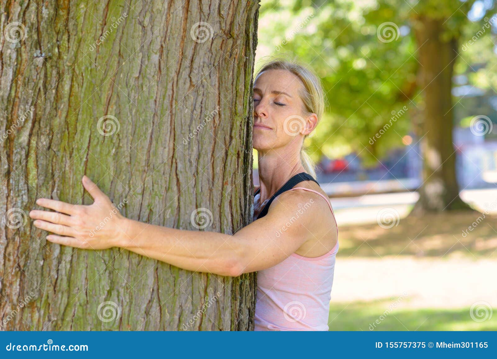 Attractive Blond Female Nature Lover Hugging Tree Stock Image Image