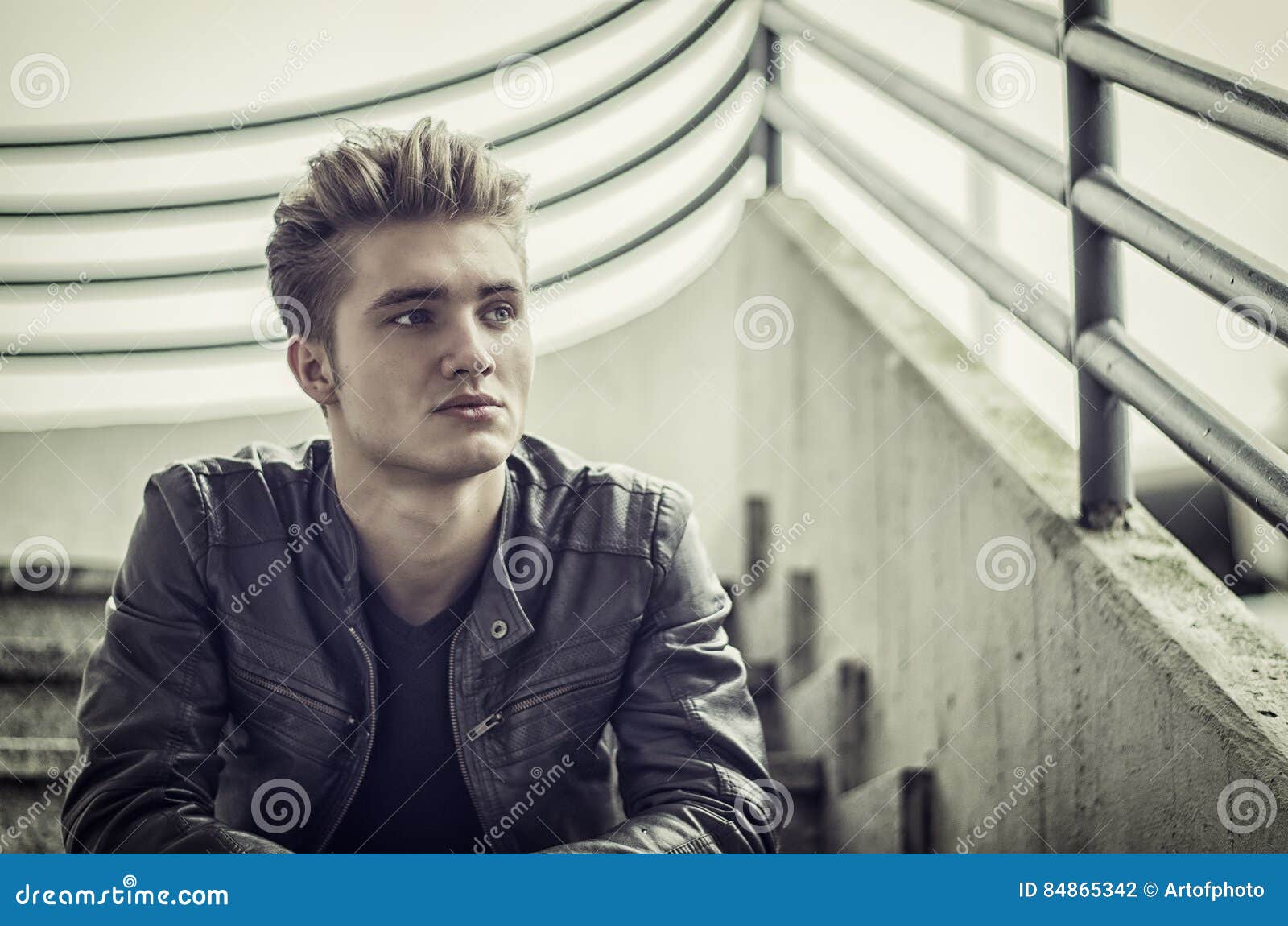 Attractive Blond Young Man Sitting on Stairs Stock Photo - Image of ...