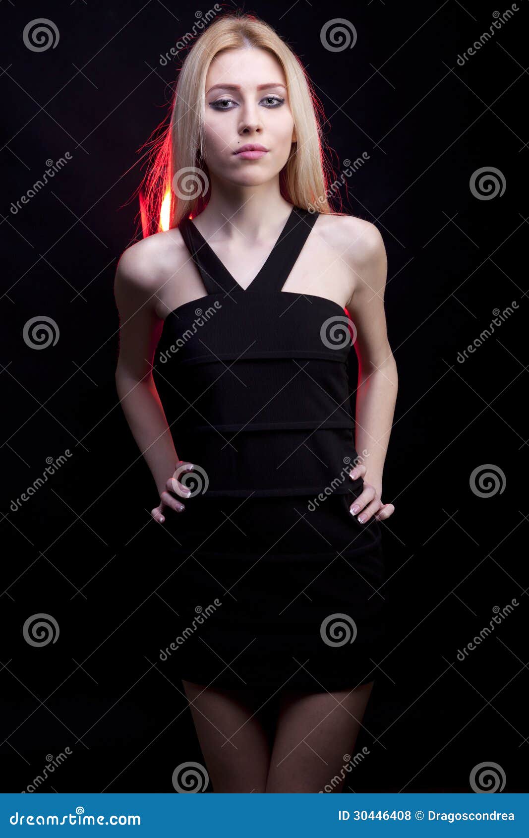 Attractive Blonde Model with a Red Light Behind Stock Photo - Image of ...
