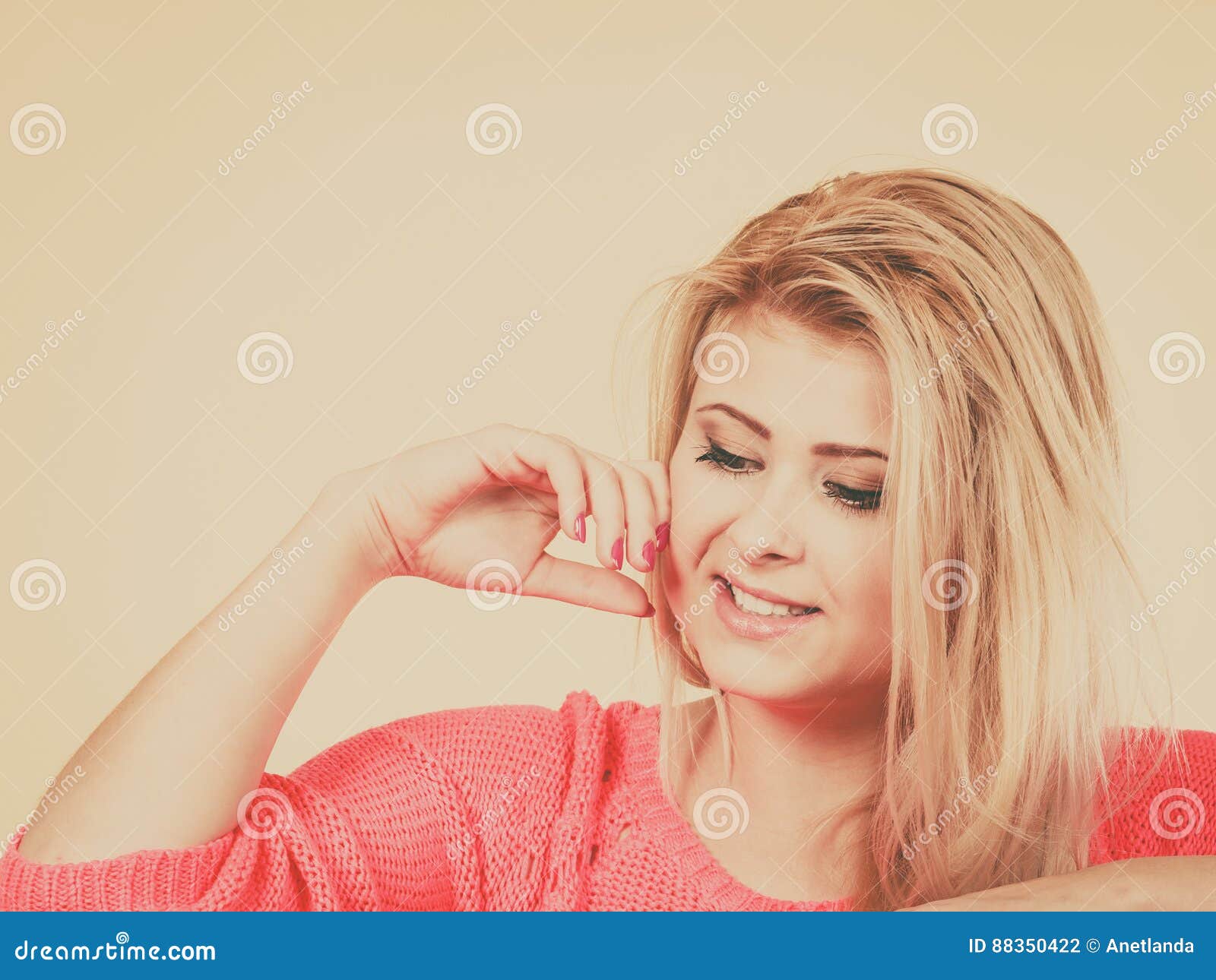 Attractive Blonde Woman Looking Down and Thinking Stock Photo - Image ...