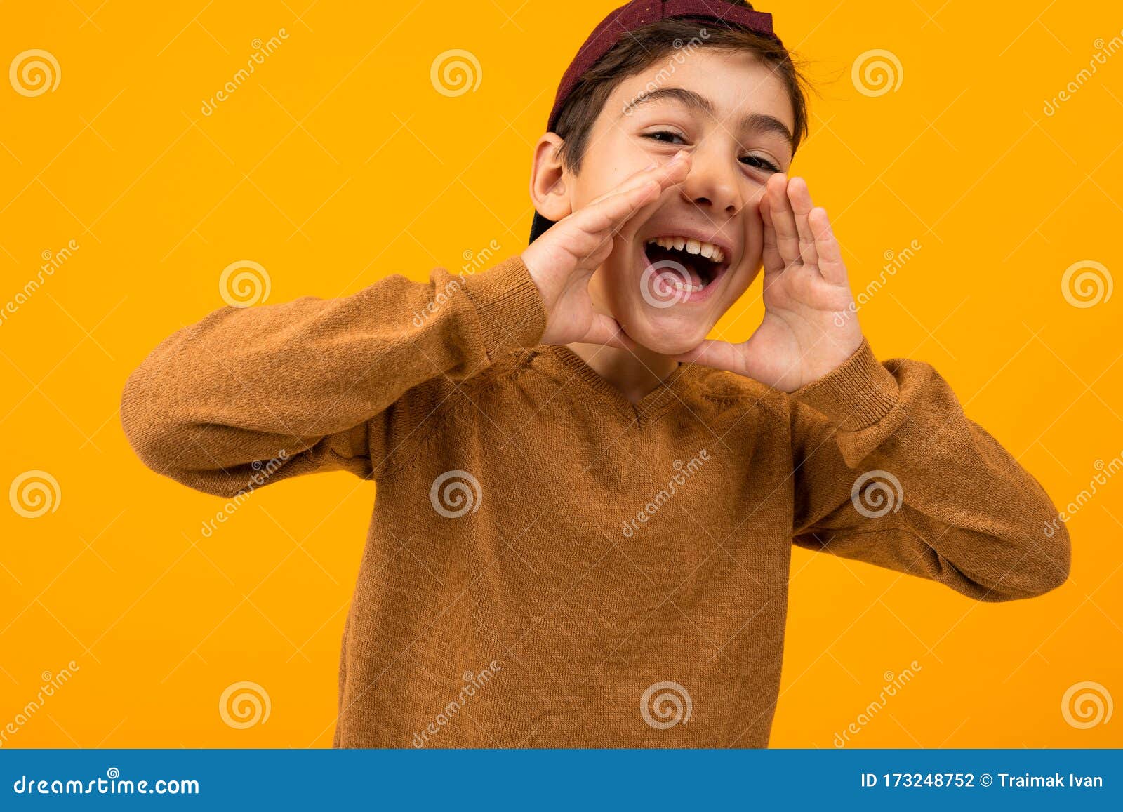 Attractive Boy Screaming Close-up on a Yellow Studio Background Stock ...