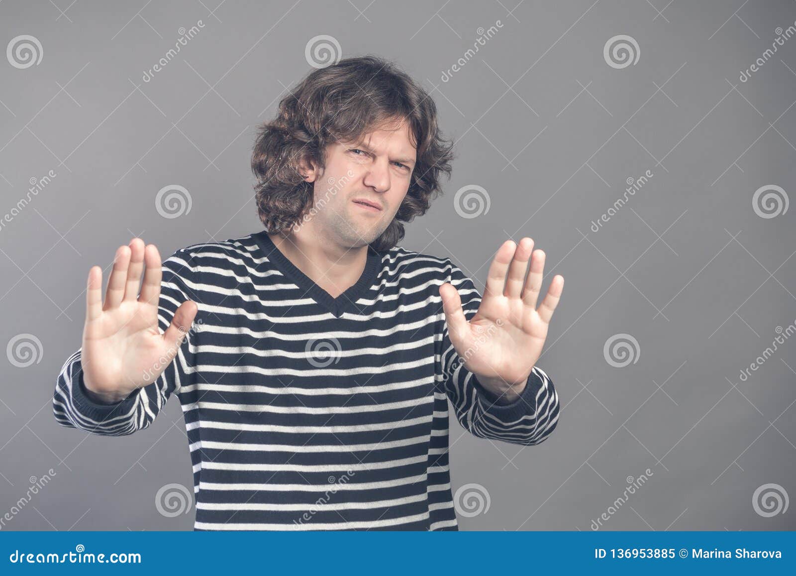 Attractive Brunet Male Shows Refusal Gesture Curly Man Does Not Want