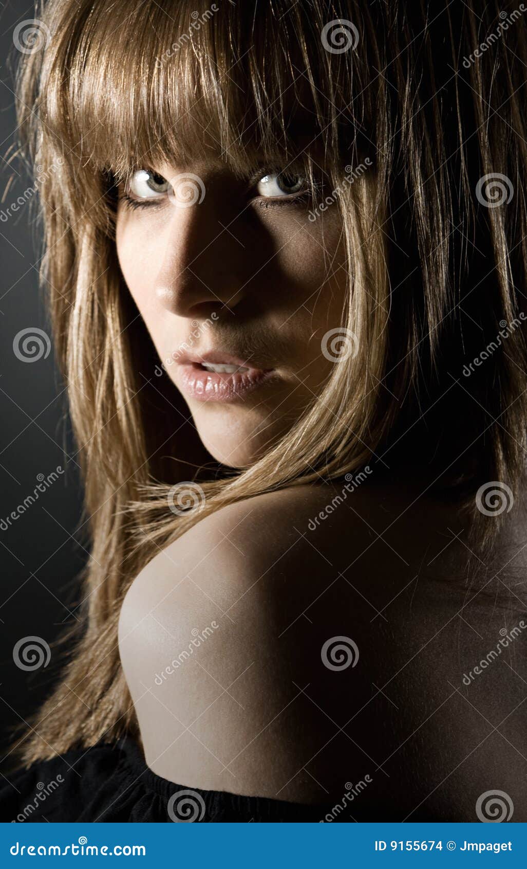 Attractive Brunette Looking Over Her Shoulder Stock Photo - Image of ...