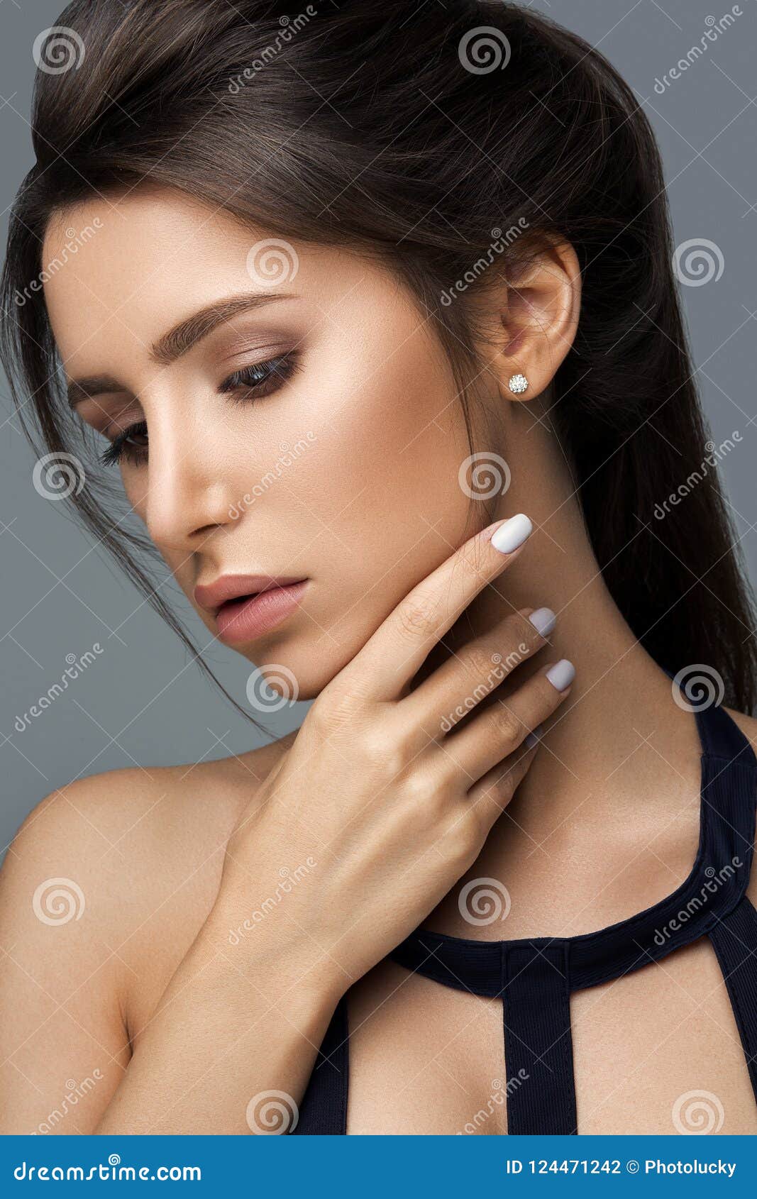 Attractive Brunette With Professional Make Up Of Flawless Face And