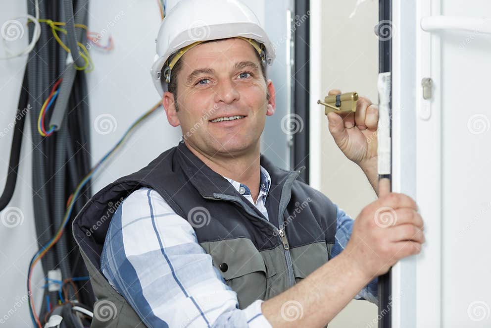 Attractive Builder Installing Lock in Door Stock Image - Image of ...