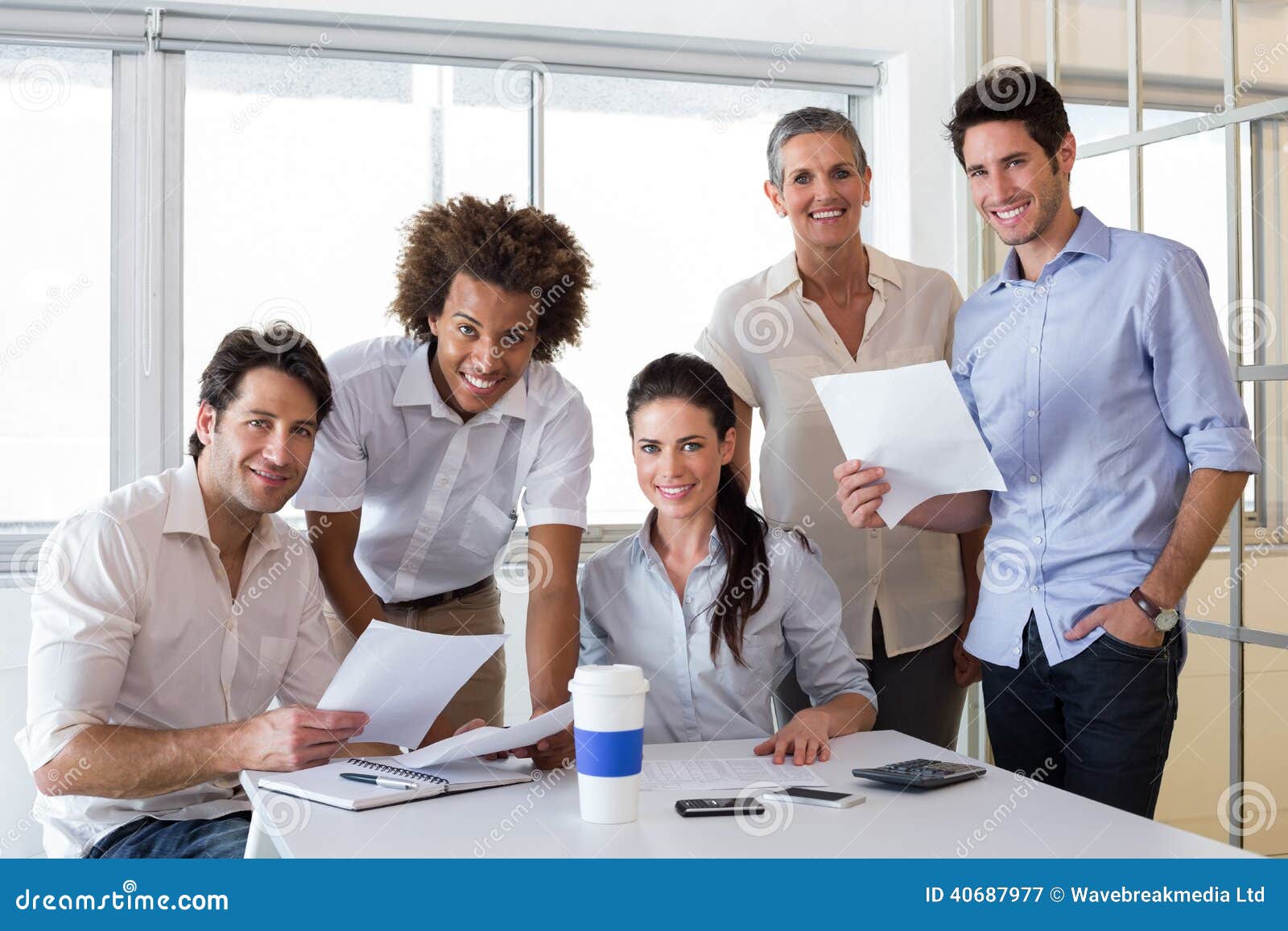 Attractive Business People Smiling in the Workplace Stock Image - Image ...