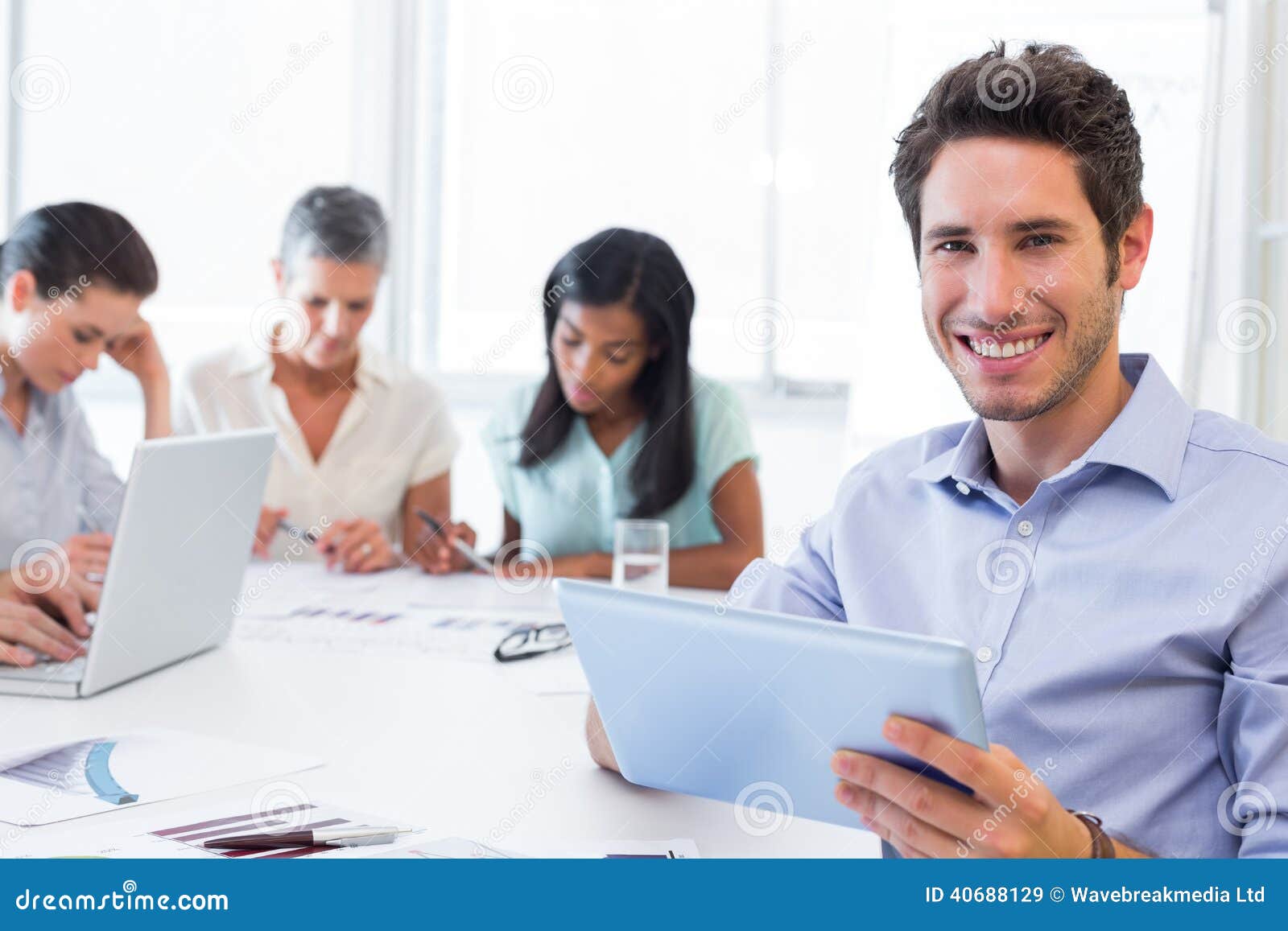 Attractive Businessman Using a Tablet at Work Stock Image - Image of ...