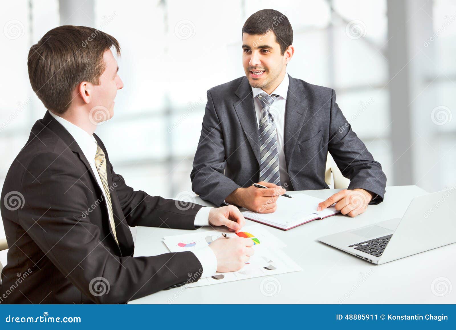 Attractive businessmen stock image. Image of desk, color - 48885911