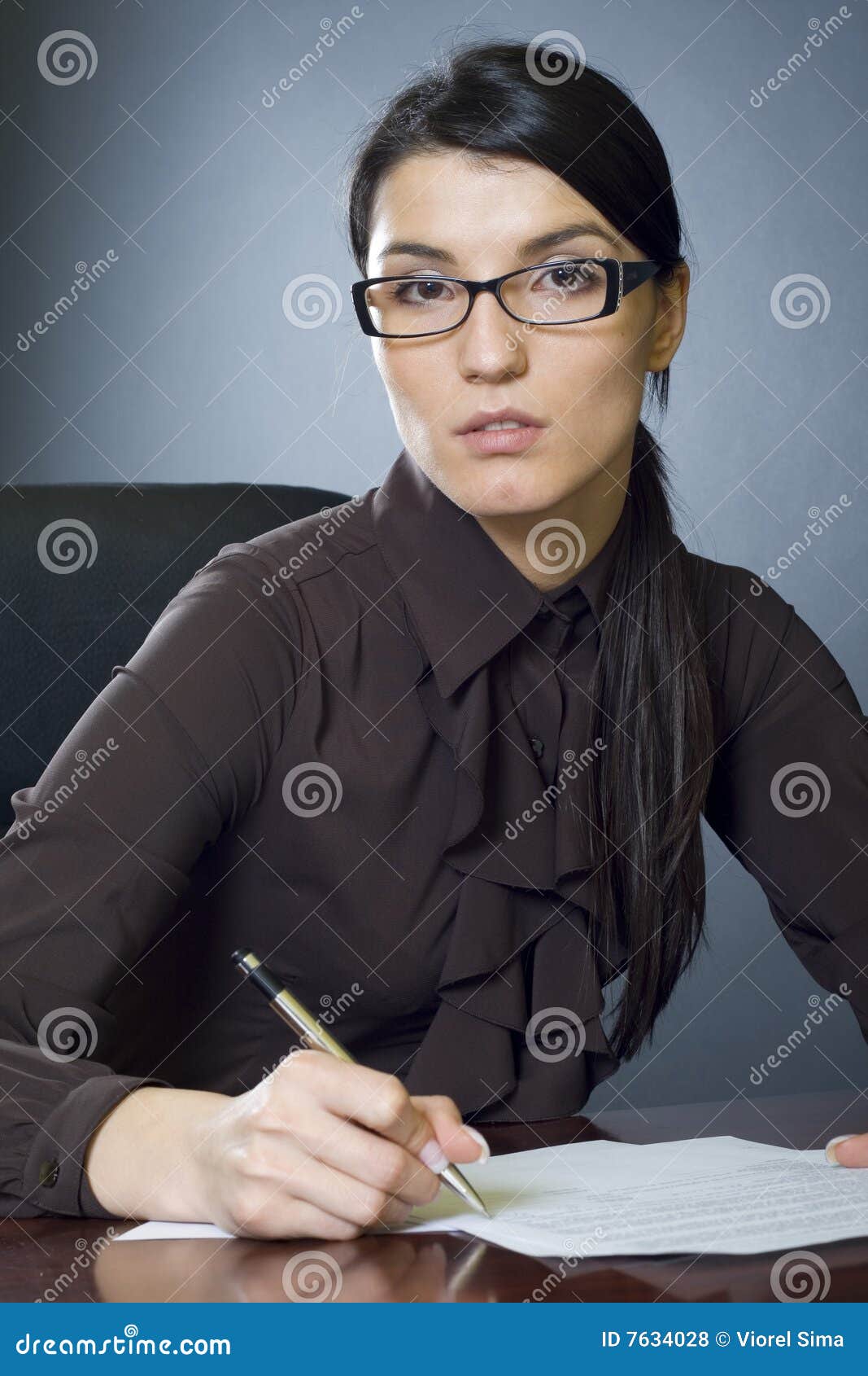 Attractive Businesswoman Signing Papers Stock Photo - Image of ...
