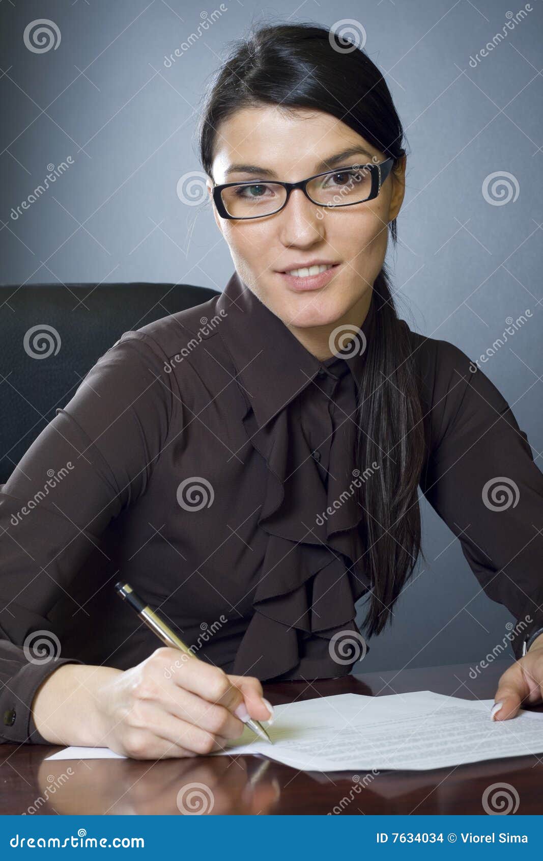 Attractive Businesswoman Signing Papers Stock Photo - Image of ...