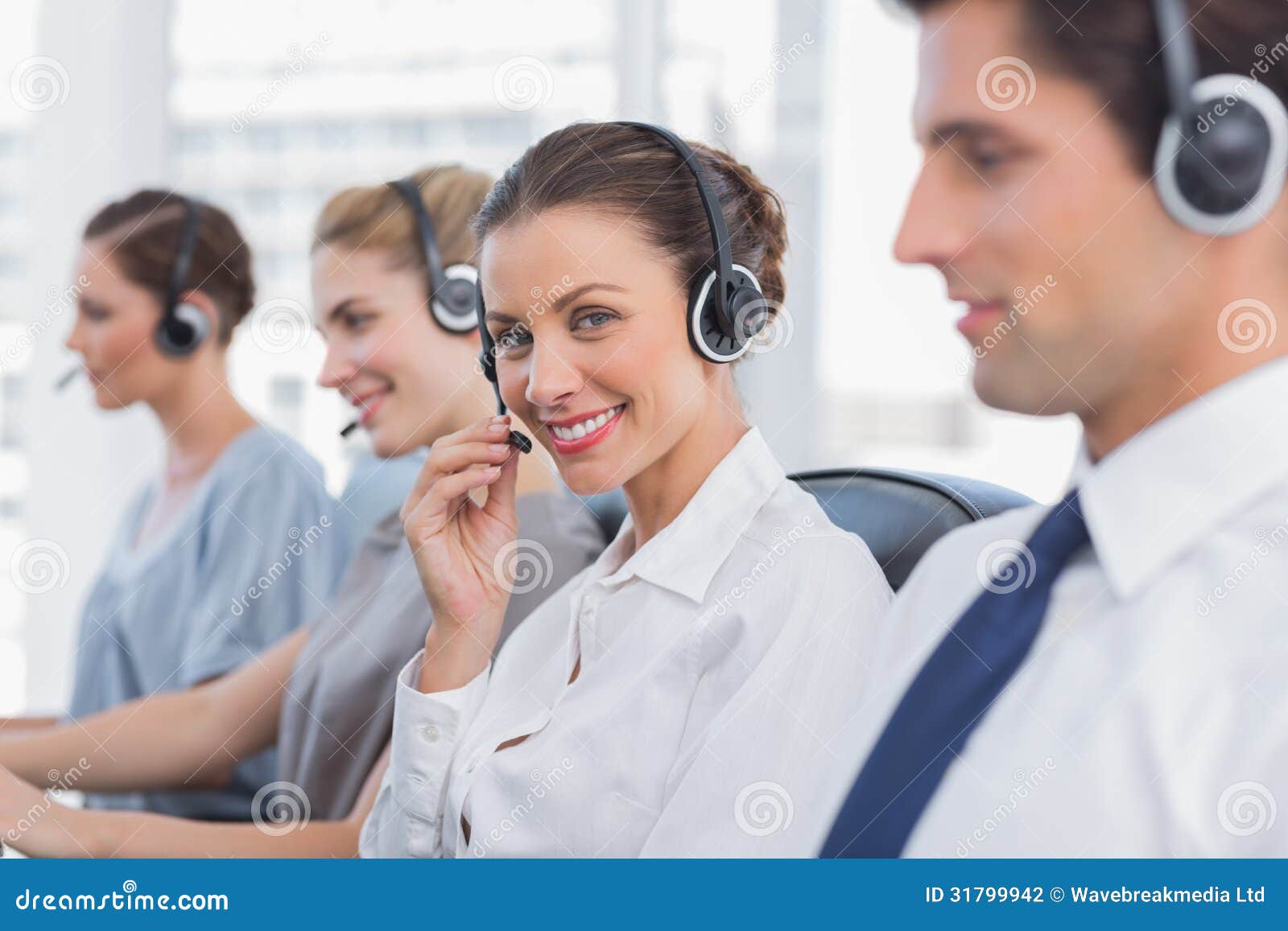 Attractive Call Centre Agent with a Headset Stock Photo - Image of male ...