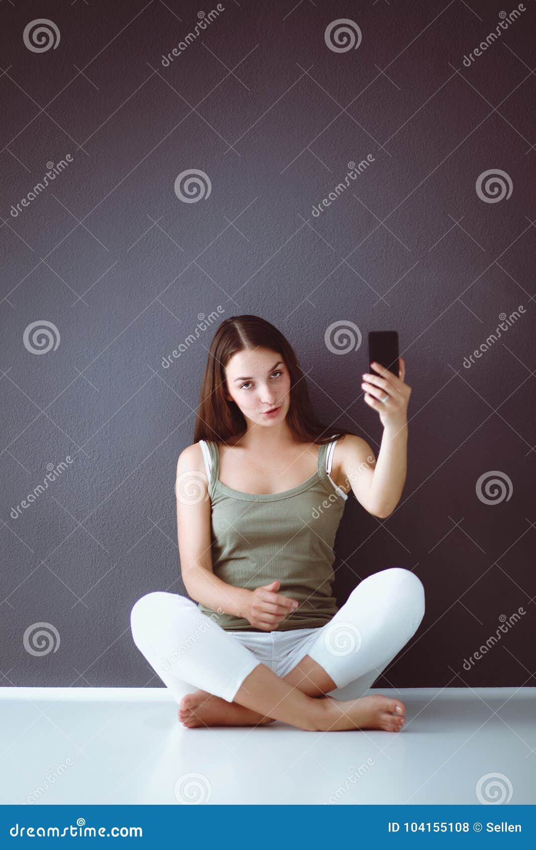 Attractive Caucasian Girl Sitting On Floor With Cup And Tablet Near