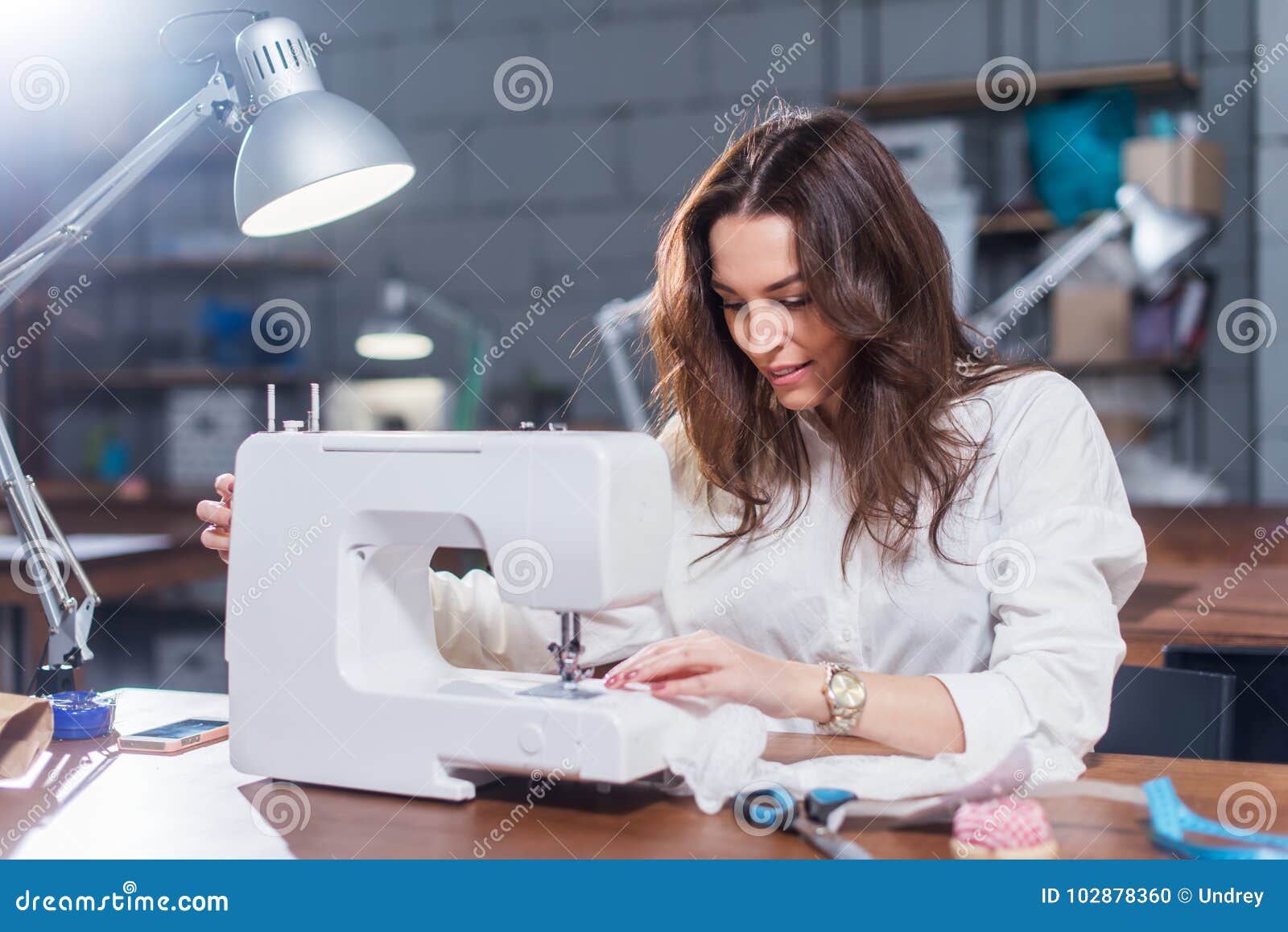 Attractive Caucasian Seamstress Working Stitching with Sewing Machine ...