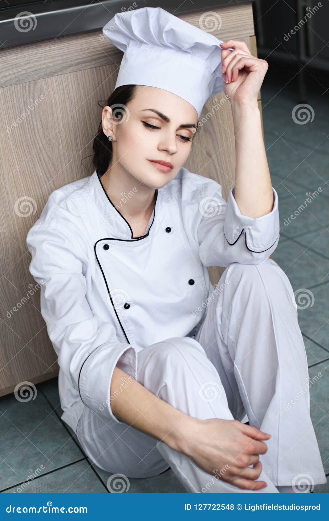 Attractive Chef Sitting on Floor Stock Photo - Image of floor, working ...