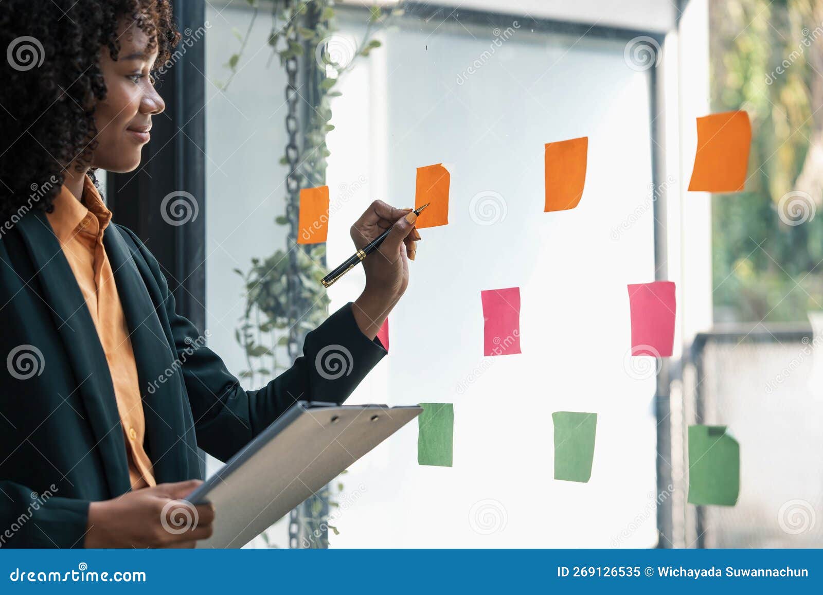 Attractive Concentrated Business Lady in Creating To-do List Using ...