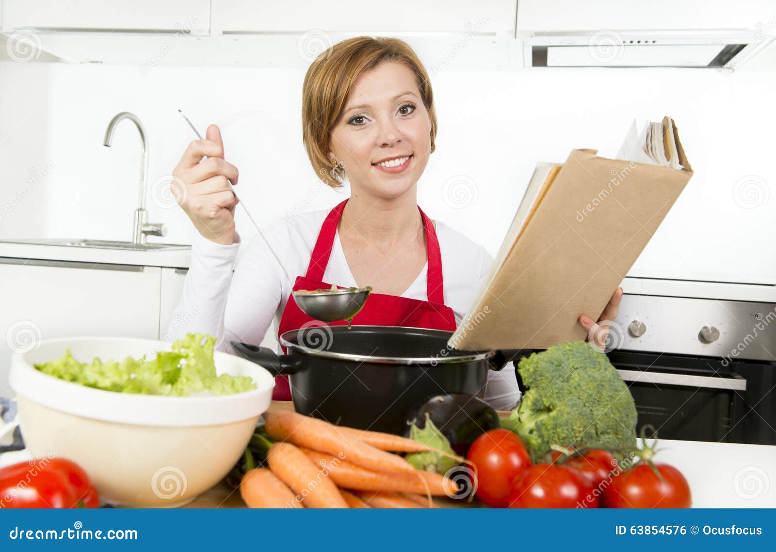 Attractive Cook Woman Preparing Vegetable Stew Soup Reading Recipe