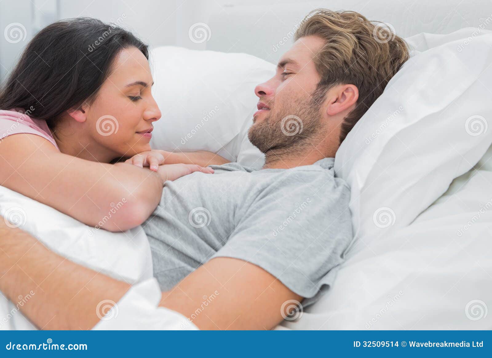Attractive Couple Awaking and Looking at Each Other Stock Photo - Image ...