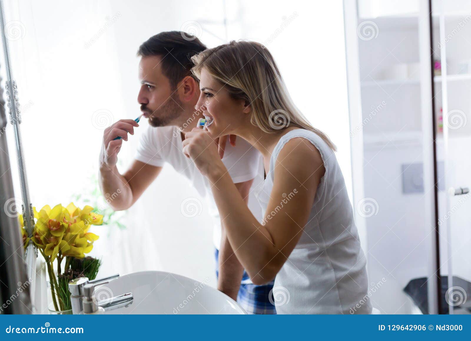 Attractive Couple Brushing Teeth in Morning Together Stock Photo ...