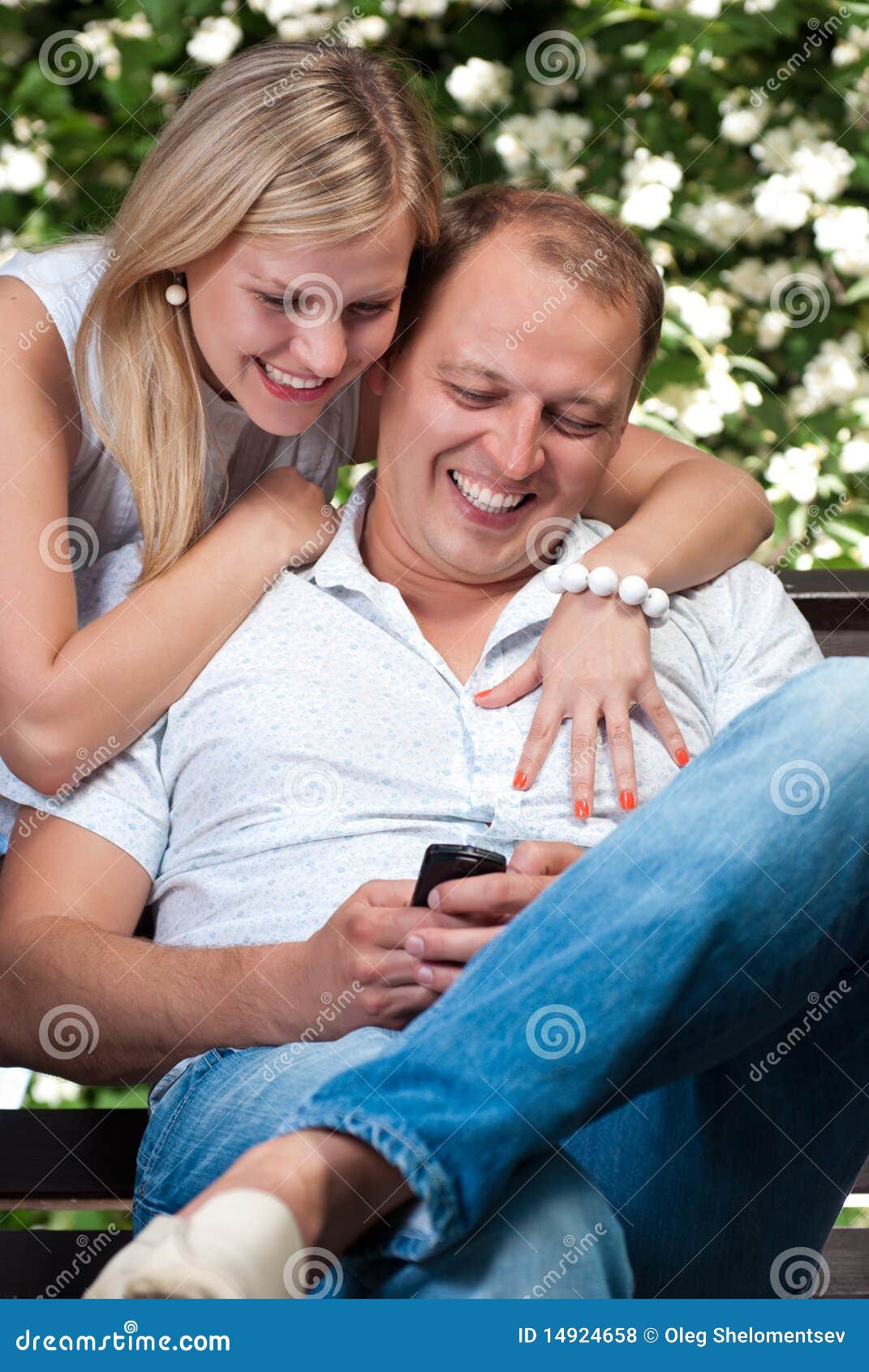 Attractive Couple with Cell Phone Stock Photo - Image of face, green ...