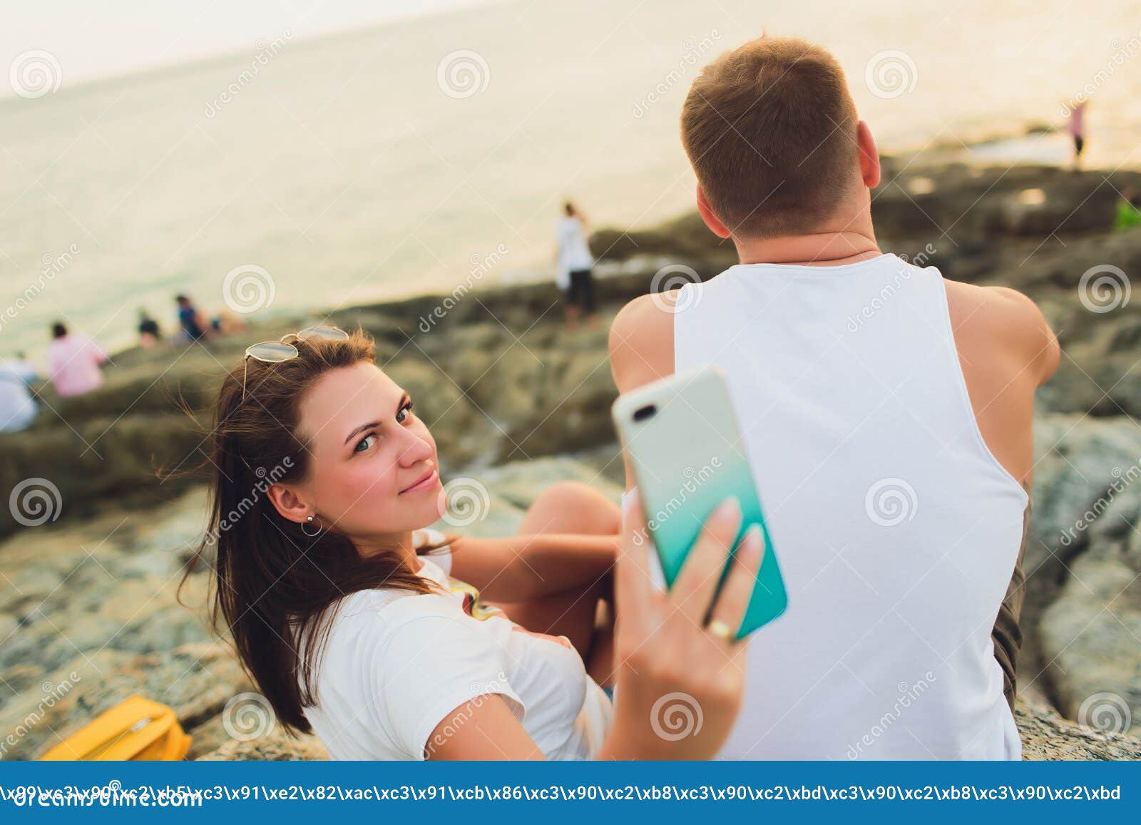 Attractive Couple Cuddling at the Beach. Rocks Stock Image - Image of ...
