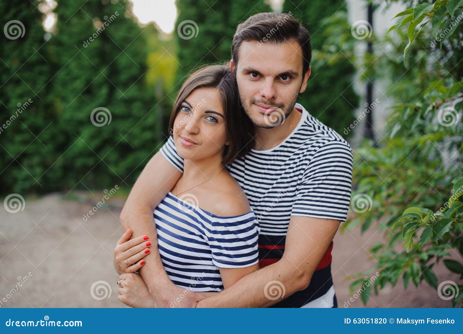 Attractive Couple Cuddling in Park Stock Photo - Image of bright ...