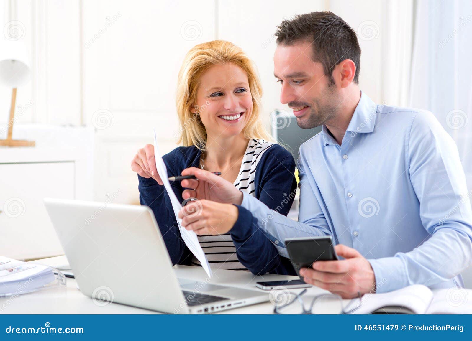 Attractive Couple Doing Administrative Paperwork Stock Image - Image of ...